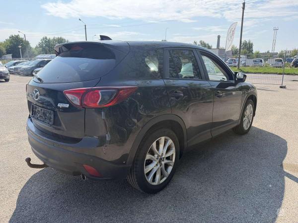 Black Mazda CX-5 2012 in Marijampole, with an engine capacity of 2.19 L and mileage of 253 thousand km for 2950 €, photo 4 on AUTOMOTO.COM.LV