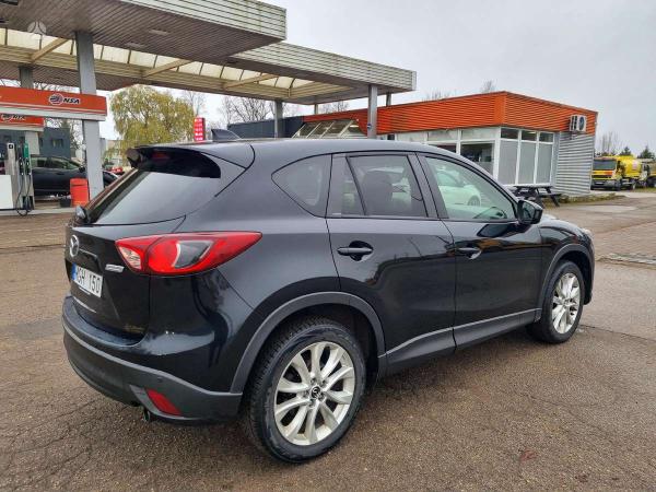Melns Mazda CX-5 2013 Tauragė, ar dzinēja tilpumu 2.20 L un nobraukumu 283 tūkst. km par 5150 €, foto 4 vietnē AUTOMOTO.COM.LV
