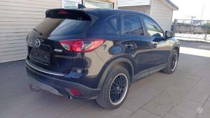 Black Mazda CX-5 2013 in Vilnius, with an engine capacity of 2.19 L and mileage of 215 thousand km for 7800 €, photo 4 on AUTOMOTO.COM.LV