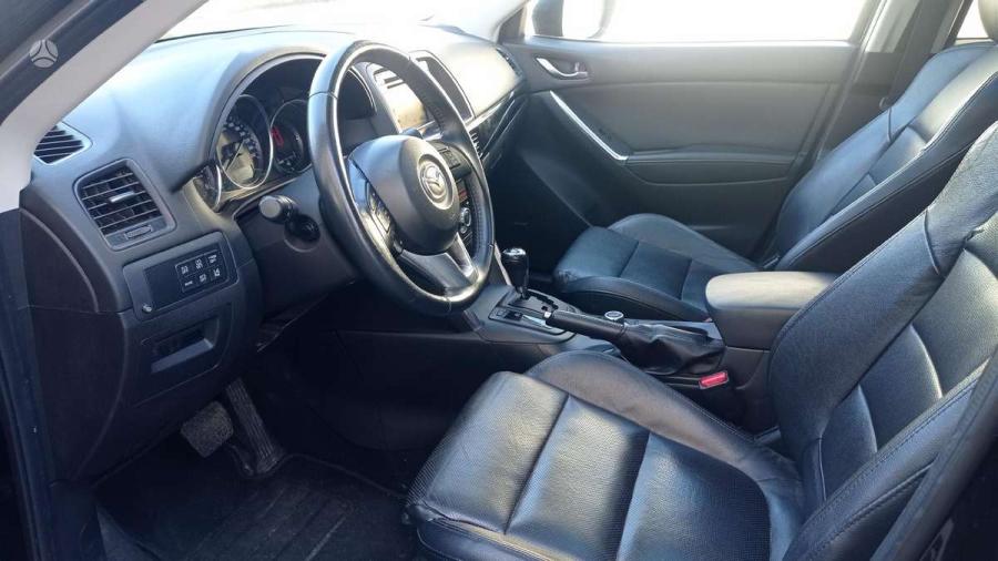 Black Mazda CX-5 2013 in Vilnius, with an engine capacity of 2.19 L and mileage of 215 thousand km for 7800 €, photo 9 on AUTOMOTO.COM.LV