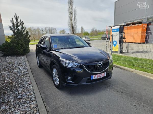 Black Mazda CX-5 2013 in Kluonaliai, with an engine capacity of 2.20 L and mileage of 221 thousand km for 6999 €, photo 2 on AUTOMOTO.COM.LV