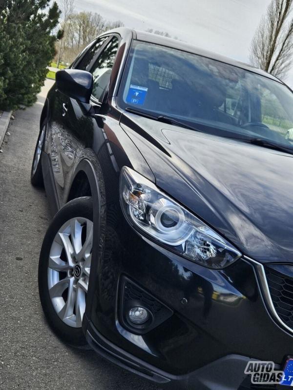 Black Mazda CX-5 2013 in Kluonaliai, with an engine capacity of 2.20 L and mileage of 221 thousand km for 6999 €, photo 5 on AUTOMOTO.COM.LV