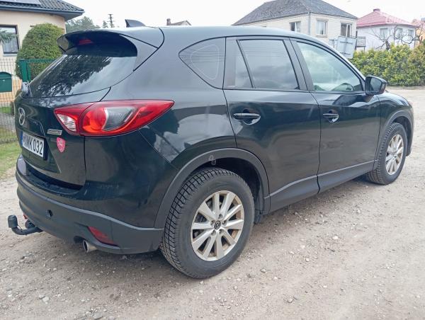 Black Mazda CX-5 2013 in Ukmerge, with an engine capacity of 2.00 L and mileage of 212 thousand km for 6200 €, photo 5 on AUTOMOTO.COM.LV