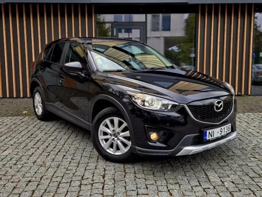 Black Mazda CX-5 2013 in Riga, with an engine capacity of 2.20 L and mileage of 187 thousand km for 11690 €, photo 4 on AUTOMOTO.COM.LV