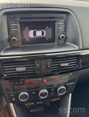 Melns Mazda CX-5 2013 Telšiai, ar dzinēja tilpumu 2.20 L un nobraukumu 239 tūkst. km par 6290 €, foto 18 vietnē AUTOMOTO.COM.LV