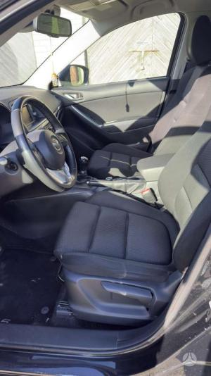 Black Mazda CX-5 2013 in Sakiai, with an engine capacity of 2.19 L and mileage of 105 thousand km for 5400 €, photo 16 on AUTOMOTO.COM.LV