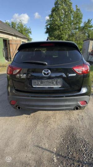 Black Mazda CX-5 2013 in Sakiai, with an engine capacity of 2.19 L and mileage of 105 thousand km for 5400 €, photo 18 on AUTOMOTO.COM.LV
