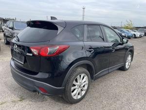 Black Mazda CX-5 2013 in Panevezys, with an engine capacity of 2.19 L and mileage of 207 thousand km for 5750 €, photo 5 on AUTOMOTO.COM.LV