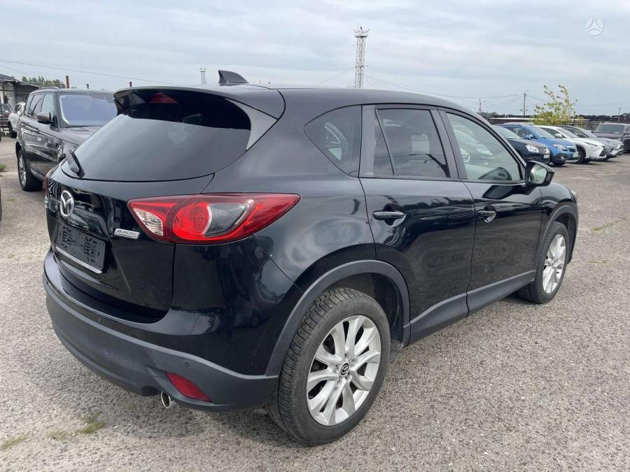 Black Mazda CX-5 2013 in Panevezys, with an engine capacity of 2.19 L and mileage of 207 thousand km for 5750 €, photo 5 on AUTOMOTO.COM.LV