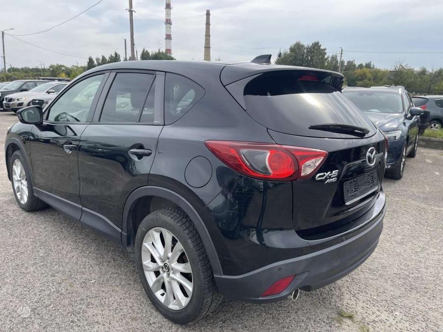 Black Mazda CX-5 2013 in Panevezys, with an engine capacity of 2.19 L and mileage of 207 thousand km for 5750 €, photo 7 on AUTOMOTO.COM.LV