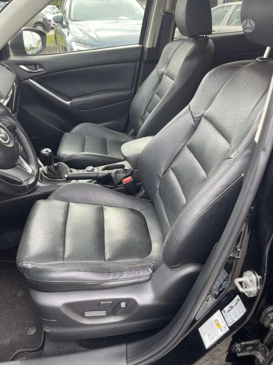 Black Mazda CX-5 2013 in Panevezys, with an engine capacity of 2.19 L and mileage of 207 thousand km for 5750 €, photo 11 on AUTOMOTO.COM.LV