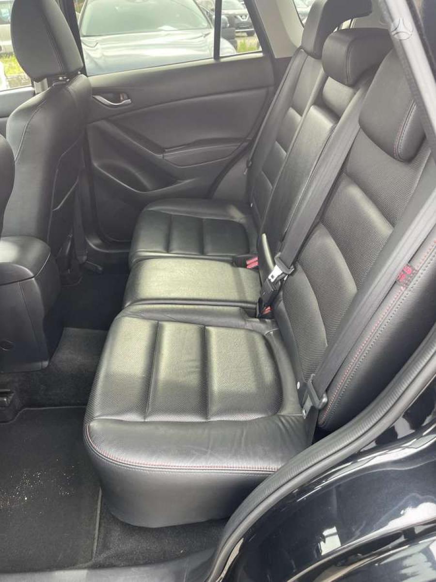 Black Mazda CX-5 2013 in Panevezys, with an engine capacity of 2.19 L and mileage of 207 thousand km for 5750 €, photo 12 on AUTOMOTO.COM.LV