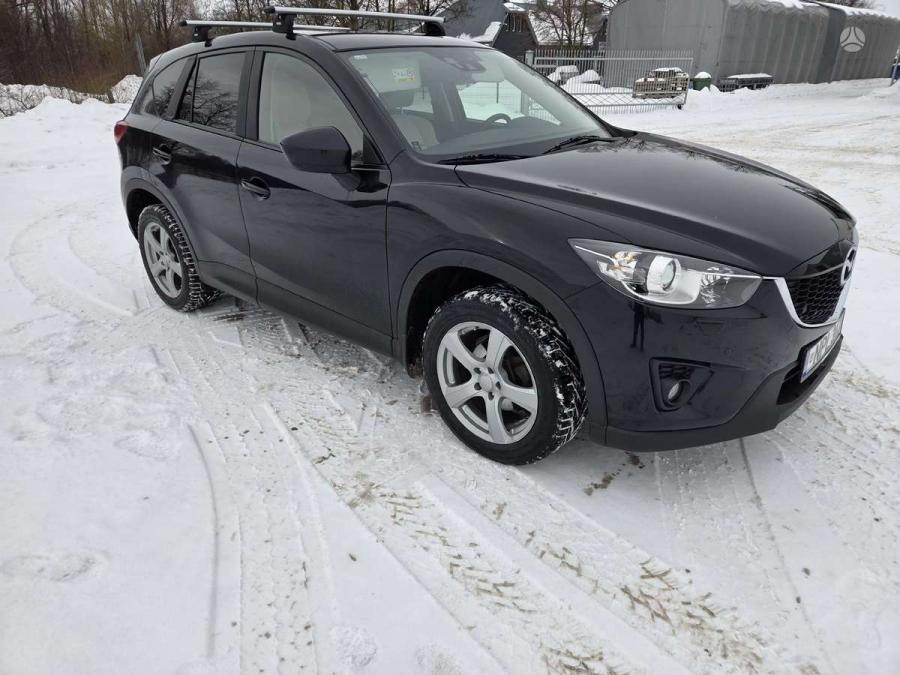 Black Mazda CX-5 2014 in Birzai, with an engine capacity of 2.19 L and mileage of 229 thousand km for 8150 €, photo 33 on AUTOMOTO.COM.LV