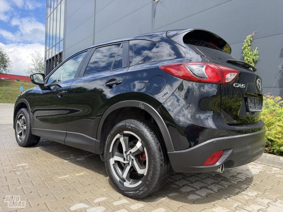 Black Mazda CX-5 2014 in Vilnius, with an engine capacity of 2.20 L and mileage of 310 thousand km for 6666 €, photo 5 on AUTOMOTO.COM.LV