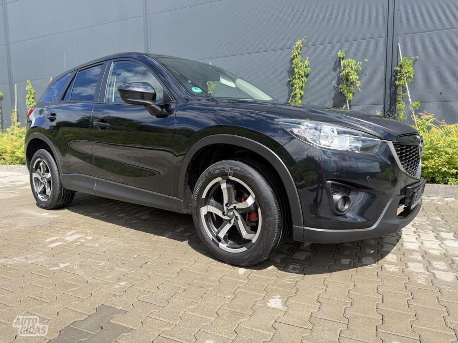 Black Mazda CX-5 2014 in Vilnius, with an engine capacity of 2.20 L and mileage of 310 thousand km for 6666 €, photo 7 on AUTOMOTO.COM.LV