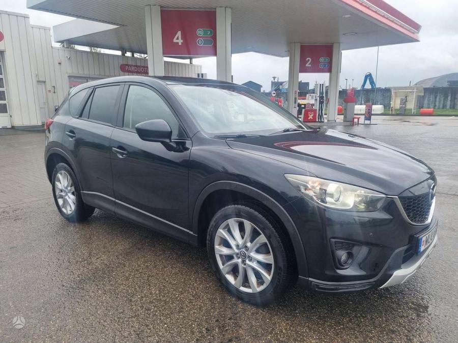 Black Mazda CX-5 2014 in Taurage, with an engine capacity of 2.19 L and mileage of 217 thousand km for 3950 €, photo 9 on AUTOMOTO.COM.LV