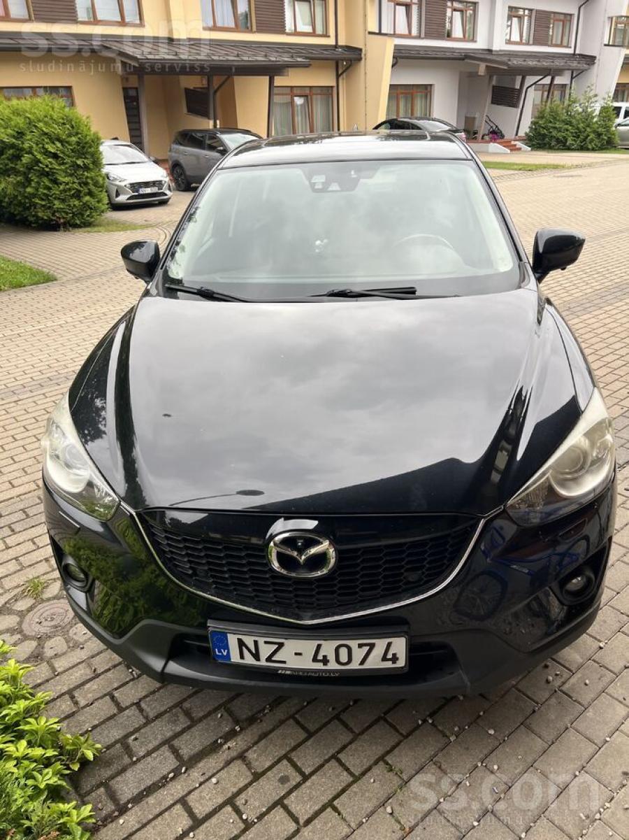 Black Mazda CX-5 2014 in Riga, with an engine capacity of 2.20 L and mileage of 218 thousand km for 10000 €, photo 1 on AUTOMOTO.COM.LV
