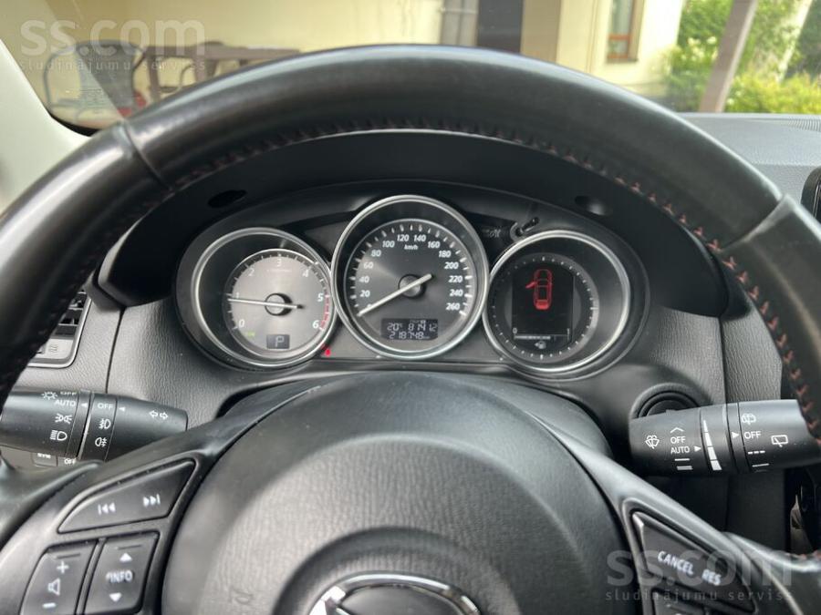 Black Mazda CX-5 2014 in Riga, with an engine capacity of 2.20 L and mileage of 218 thousand km for 10000 €, photo 4 on AUTOMOTO.COM.LV