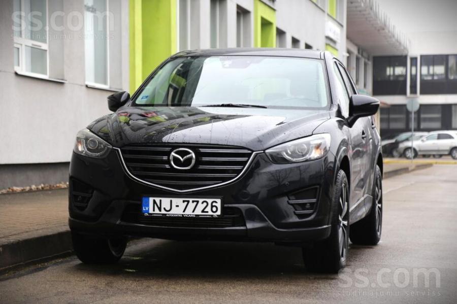 Black Mazda CX-5 2015 in Riga, with an engine capacity of 2.20 L and mileage of 230 thousand km for 7995 €, photo 1 on AUTOMOTO.COM.LV