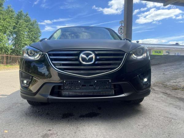Black Mazda CX-5 2015 in Kelme, with an engine capacity of 2.19 L and mileage of 219 thousand km for 8300 €, photo 2 on AUTOMOTO.COM.LV