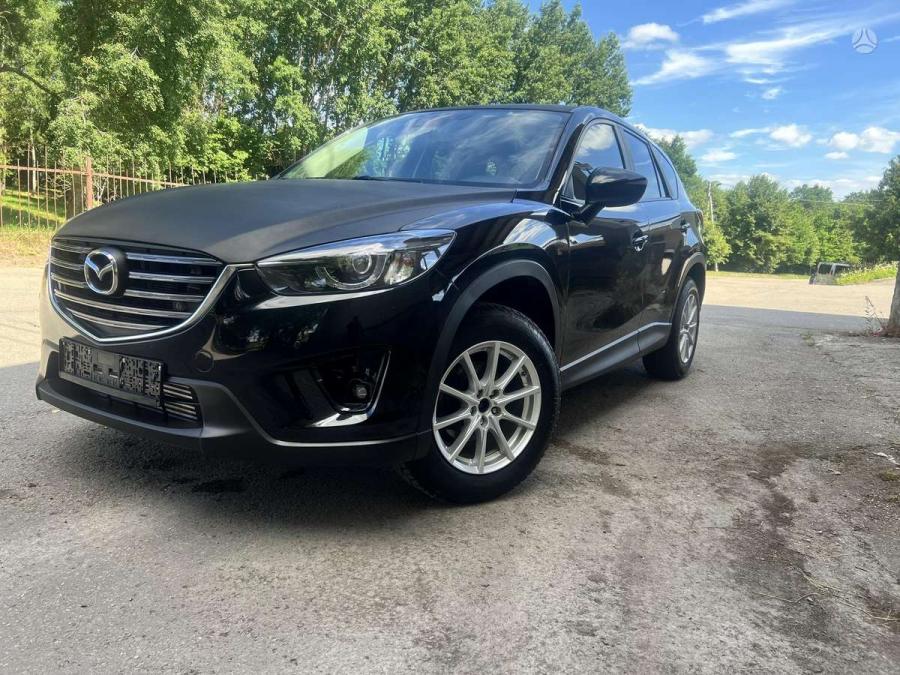 Black Mazda CX-5 2015 in Kelme, with an engine capacity of 2.19 L and mileage of 219 thousand km for 8300 €, photo 4 on AUTOMOTO.COM.LV