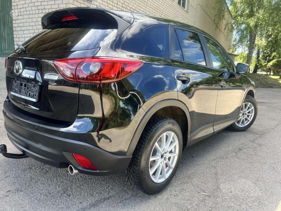 Black Mazda CX-5 2015 in Kelme, with an engine capacity of 2.19 L and mileage of 219 thousand km for 8300 €, photo 7 on AUTOMOTO.COM.LV