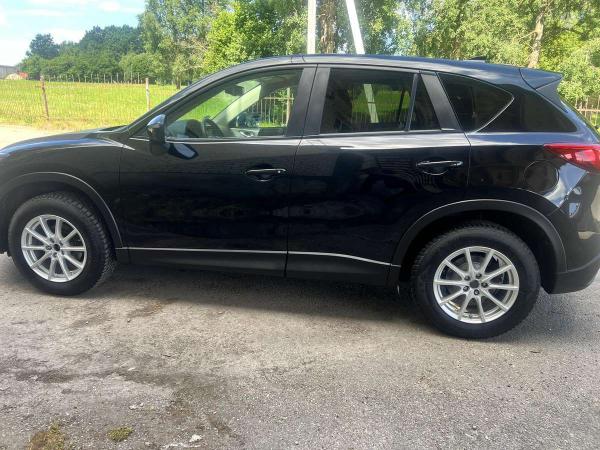 Black Mazda CX-5 2015 in Kelme, with an engine capacity of 2.19 L and mileage of 219 thousand km for 8300 €, photo 7 on AUTOMOTO.COM.LV
