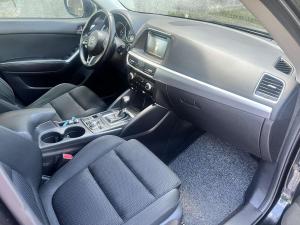 Black Mazda CX-5 2015 in Kelme, with an engine capacity of 2.19 L and mileage of 219 thousand km for 8300 €, photo 15 on AUTOMOTO.COM.LV