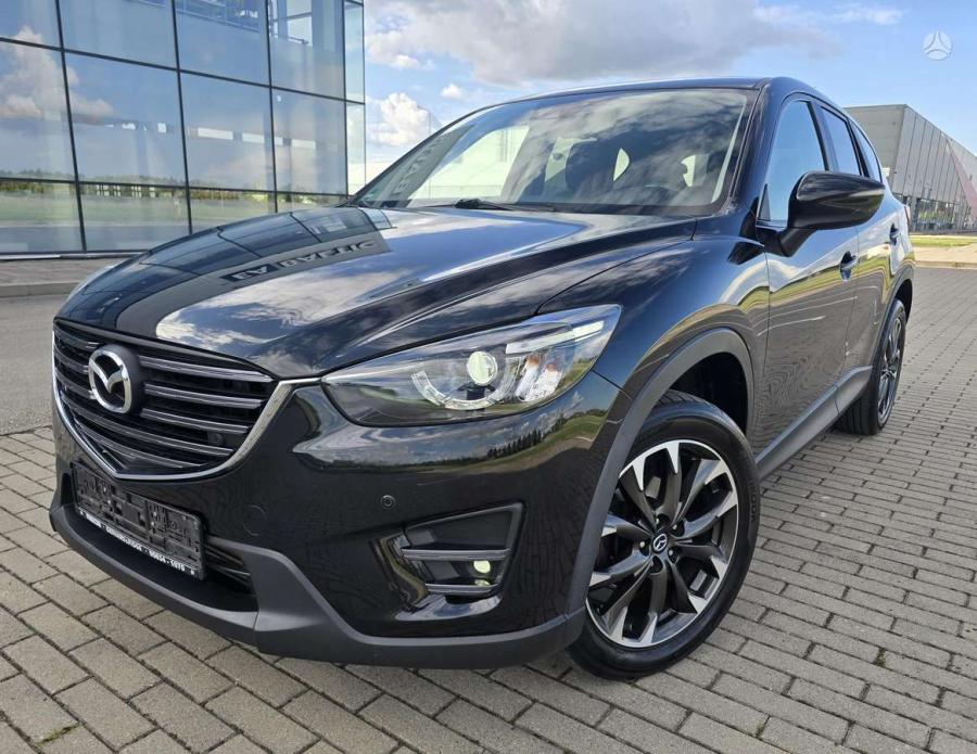 Black Mazda CX-5 2015 in Panevezys, with an engine capacity of 2.19 L and mileage of 147 thousand km for 9799 €, photo 1 on AUTOMOTO.COM.LV