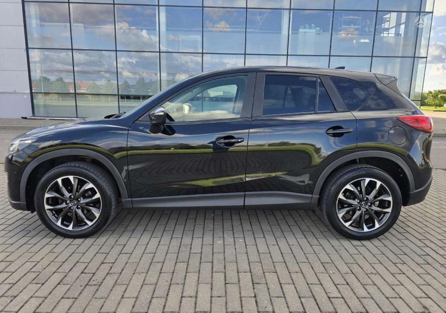 Black Mazda CX-5 2015 in Panevezys, with an engine capacity of 2.19 L and mileage of 147 thousand km for 9799 €, photo 4 on AUTOMOTO.COM.LV