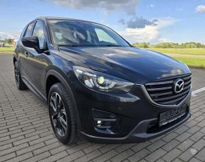 Black Mazda CX-5 2015 in Panevezys, with an engine capacity of 2.19 L and mileage of 147 thousand km for 9799 €, photo 9 on AUTOMOTO.COM.LV