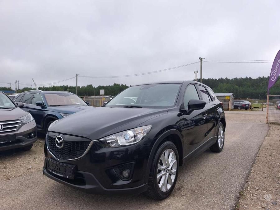 Black Mazda CX-5 2015 in Vilnius, with an engine capacity of 2.00 L and mileage of 120 thousand km for 13650 €, photo 1 on AUTOMOTO.COM.LV