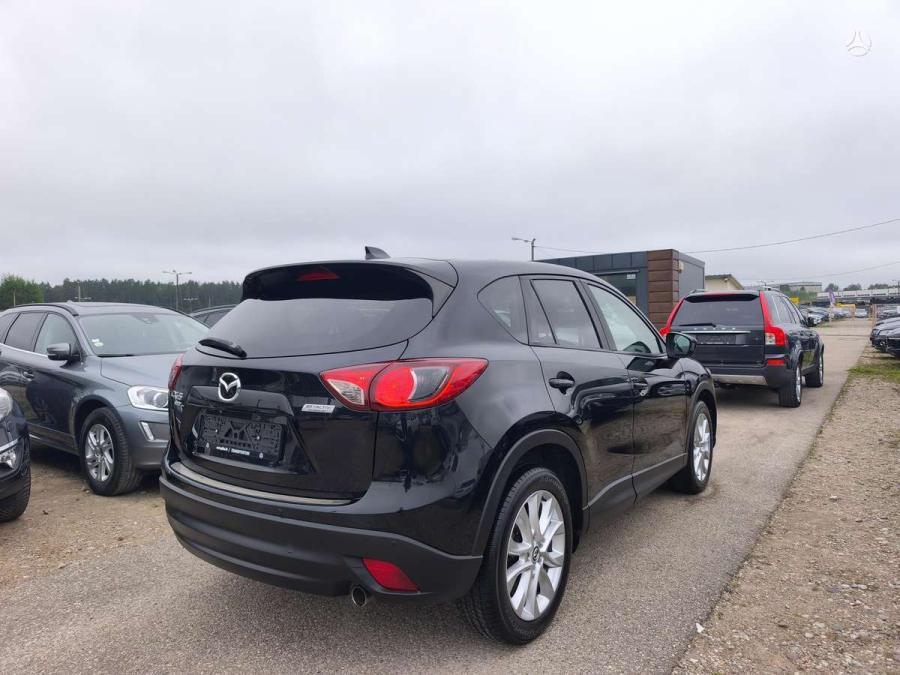 Black Mazda CX-5 2015 in Vilnius, with an engine capacity of 2.00 L and mileage of 120 thousand km for 13650 €, photo 5 on AUTOMOTO.COM.LV