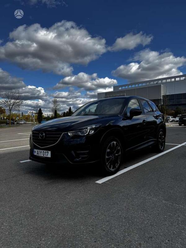 Black Mazda CX-5 2015 in Vilnius, with an engine capacity of 2.19 L and mileage of 219 thousand km for 10200 €, photo 4 on AUTOMOTO.COM.LV