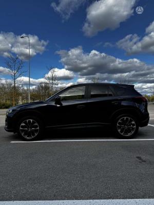 Black Mazda CX-5 2015 in Vilnius, with an engine capacity of 2.19 L and mileage of 219 thousand km for 10200 €, photo 5 on AUTOMOTO.COM.LV