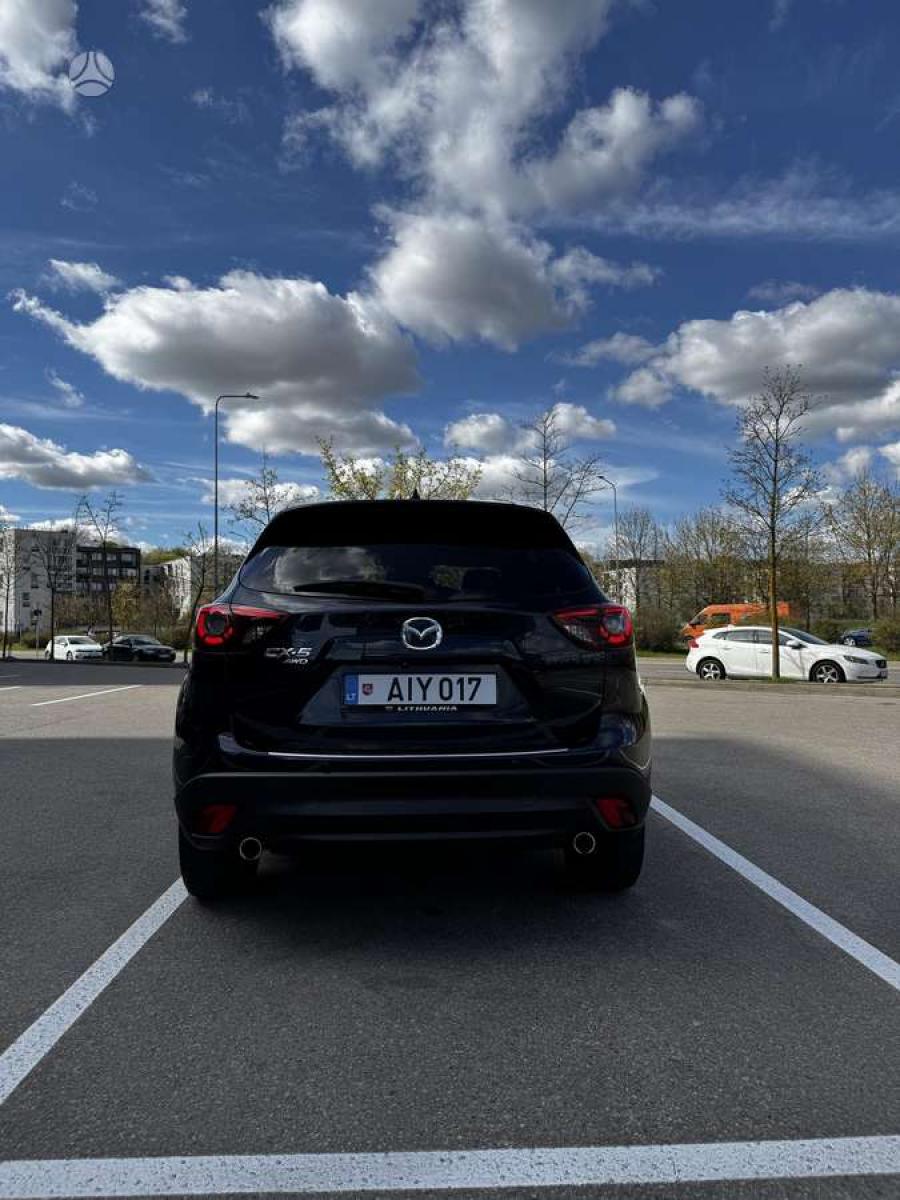 Black Mazda CX-5 2015 in Vilnius, with an engine capacity of 2.19 L and mileage of 219 thousand km for 10200 €, photo 7 on AUTOMOTO.COM.LV