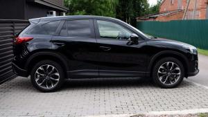 Black Mazda CX-5 2016 in Marijampole, with an engine capacity of 2.19 L and mileage of 202 thousand km for 10490 €, photo 6 on AUTOMOTO.COM.LV