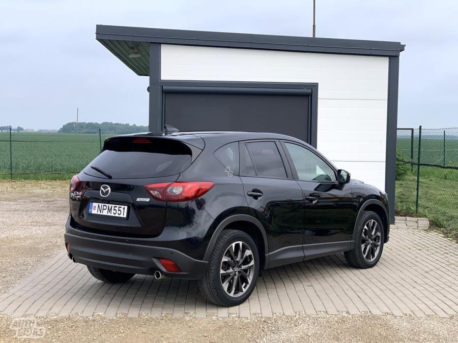 Black Mazda CX-5 2017 in Kaunas, with an engine capacity of 2.20 L and mileage of 143 thousand km for 11599 €, photo 6 on AUTOMOTO.COM.LV