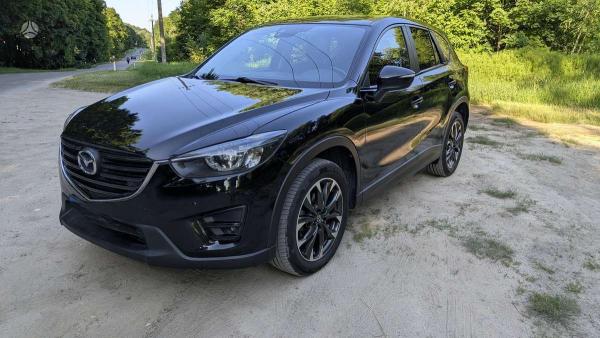 Black Mazda CX-5 2017 in Vilnius, with an engine capacity of 2.19 L and mileage of 140 thousand km for 10800 €, photo 4 on AUTOMOTO.COM.LV