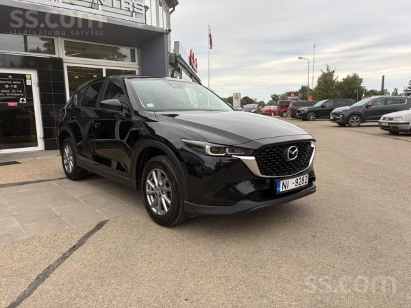 Black Mazda CX-5 2022 in Jekabpils, with an engine capacity of 2.00 L and mileage of 64 thousand km for 18500 €, photo 1 on AUTOMOTO.COM.LV