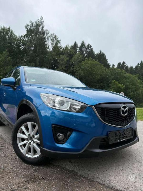 Blue Mazda CX-5 2013 in Plunge, with an engine capacity of 2.19 L and mileage of 170 thousand km for 6400 €, photo 1 on AUTOMOTO.COM.LV