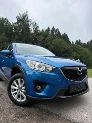Zils Mazda CX-5 2013 Plungė, ar dzinēja tilpumu 2.19 L un nobraukumu 170 tūkst. km par 6400 €, foto  vietnē AUTOMOTO.COM.LV