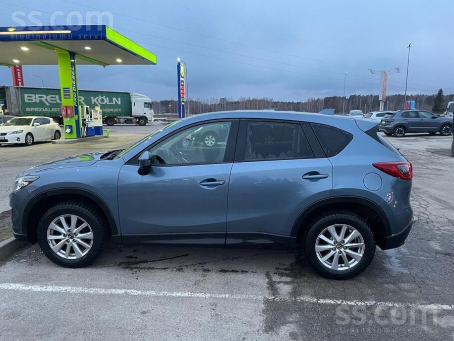Blue Mazda CX-5 2014 in Riga, with an engine capacity of 2.00 L and mileage of 111 thousand km for 9500 €, photo 1 on AUTOMOTO.COM.LV