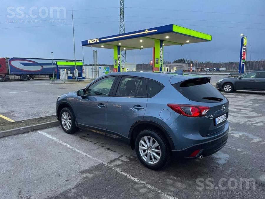 Blue Mazda CX-5 2014 in Riga, with an engine capacity of 2.00 L and mileage of 111 thousand km for 9500 €, photo 4 on AUTOMOTO.COM.LV