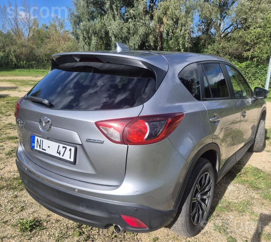 Pelēks Mazda CX-5 2013 Rīga, ar dzinēja tilpumu 2.20 L un nobraukumu 246 tūkst. km par 7390 €, foto 5 vietnē AUTOMOTO.COM.LV