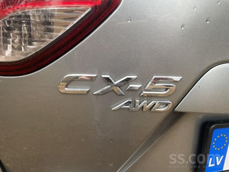Pelēks Mazda CX-5 2013 Ogre, ar dzinēja tilpumu 2.20 L un nobraukumu 285 tūkst. km par 8000 €, foto 11 vietnē AUTOMOTO.COM.LV