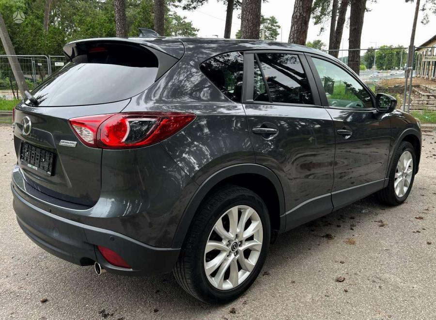 Grey Mazda CX-5 2013 in Vilnius, with an engine capacity of 2.20 L and mileage of 185 thousand km for 7400 €, photo 4 on AUTOMOTO.COM.LV