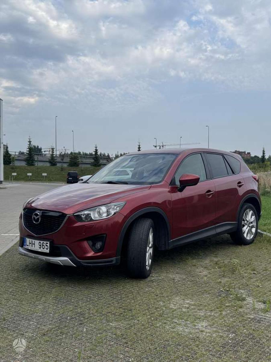 Red Mazda CX-5 2012 in Vilnius, with an engine capacity of 2.19 L and mileage of 185 thousand km for 8300 €, photo 4 on AUTOMOTO.COM.LV