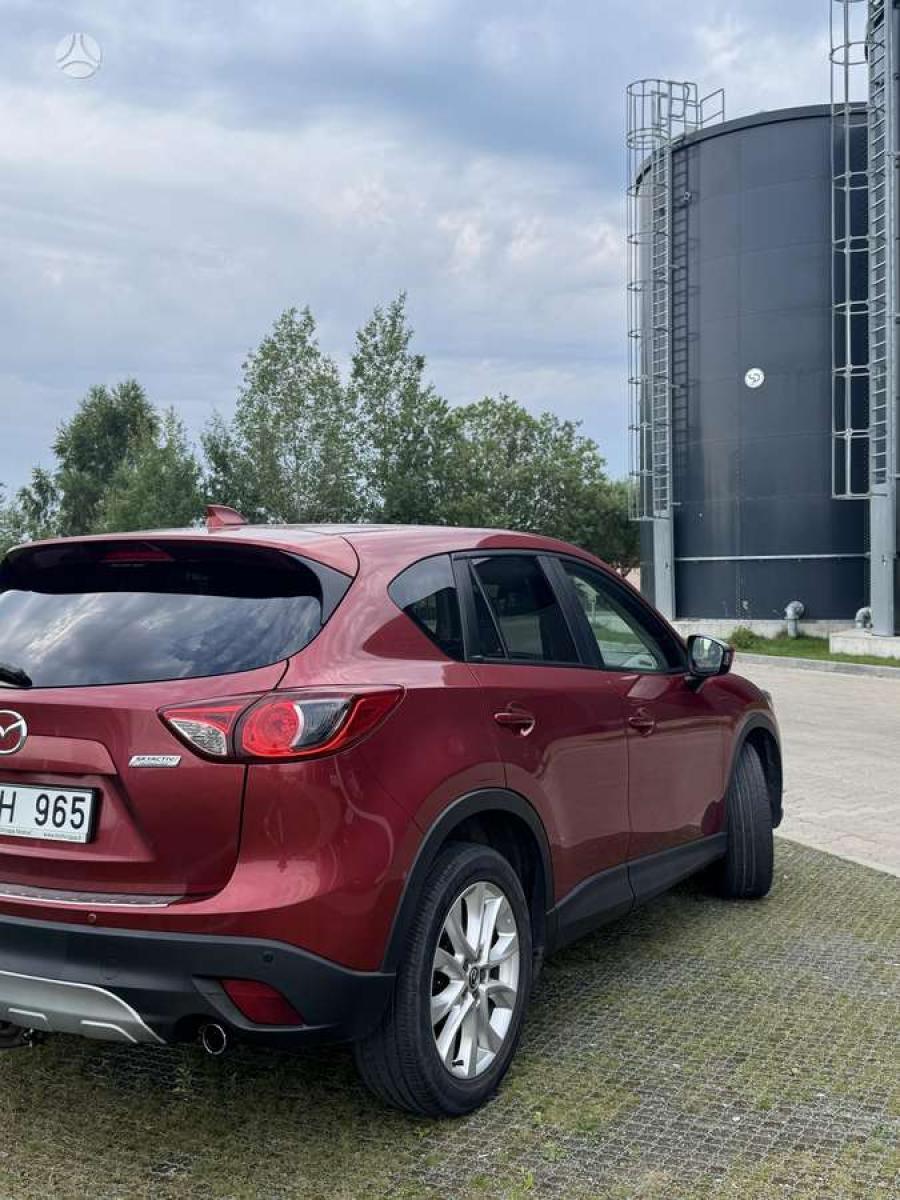 Red Mazda CX-5 2012 in Vilnius, with an engine capacity of 2.19 L and mileage of 185 thousand km for 8300 €, photo 6 on AUTOMOTO.COM.LV