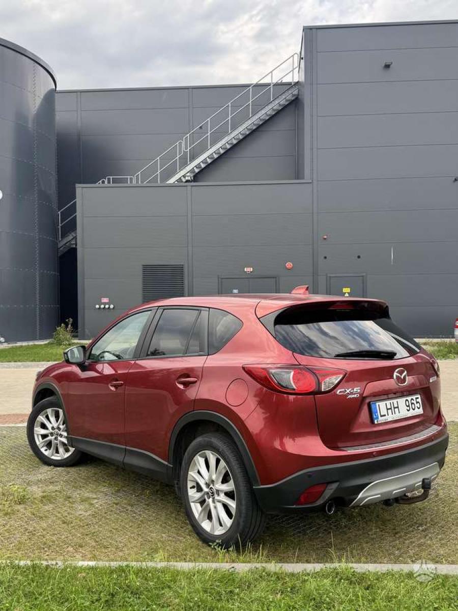 Red Mazda CX-5 2012 in Vilnius, with an engine capacity of 2.19 L and mileage of 185 thousand km for 8300 €, photo 7 on AUTOMOTO.COM.LV